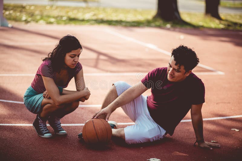Couple on basketball court stock image. Image of city - 216847439