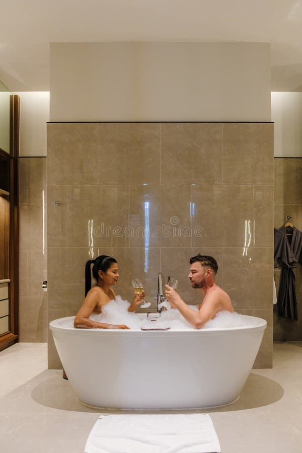 Couple in a Bath Tub in a Luxury Hotel Bathroom Stock Image - Image of ...