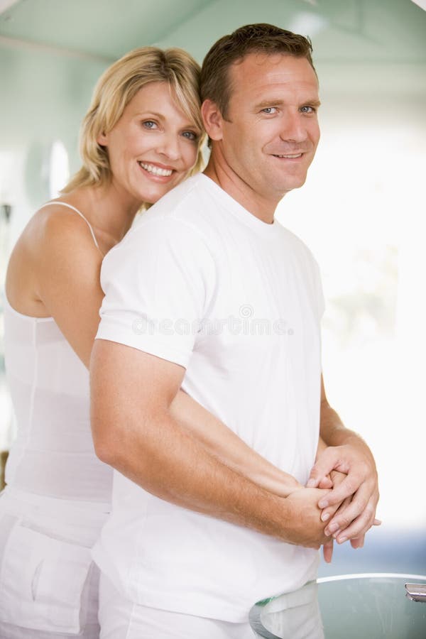 Couple in Bathroom Embracing Stock Image - Image of camera, nightwear ...
