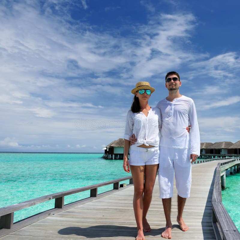 Couple on a Beach Jetty at Maldives Stock Photo - Image of exotic ...