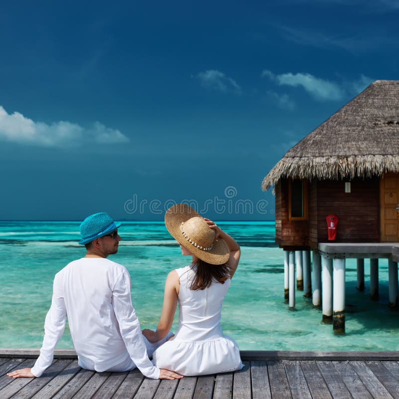 Couple on a Beach Jetty at Maldives Stock Image - Image of romance ...