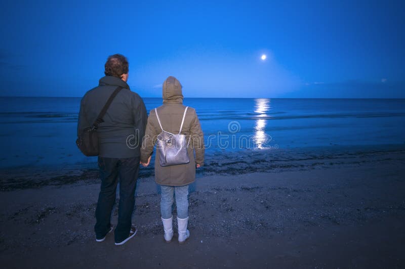 Couple on the Beach by Night Stock Image - Image of serenity, beach ...