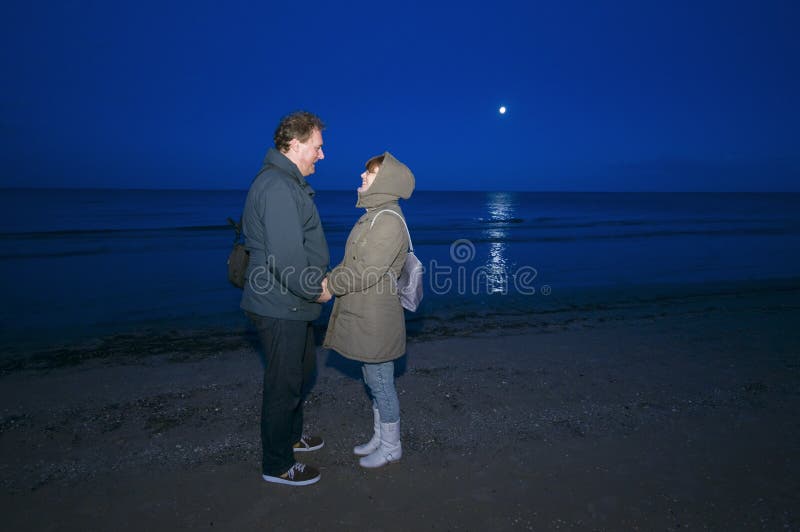 Couple on the Beach by Night Stock Image - Image of serenity, beach ...