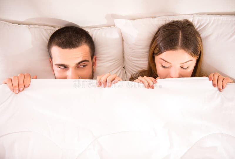 Couple in bed stock image. Image of night, lying, happiness - 60449615
