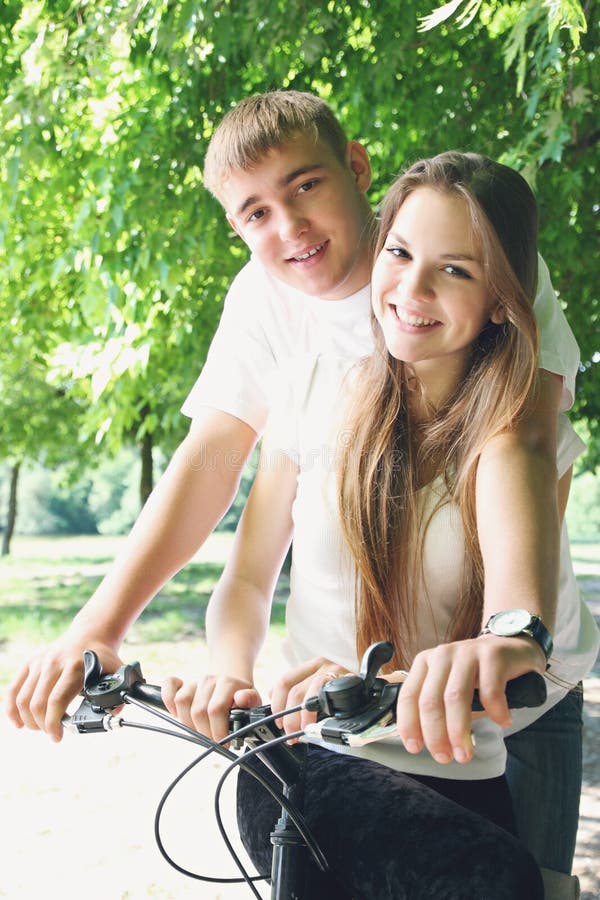 Couple on a bicycle stock photo. Image of beauty, cycling - 31523328