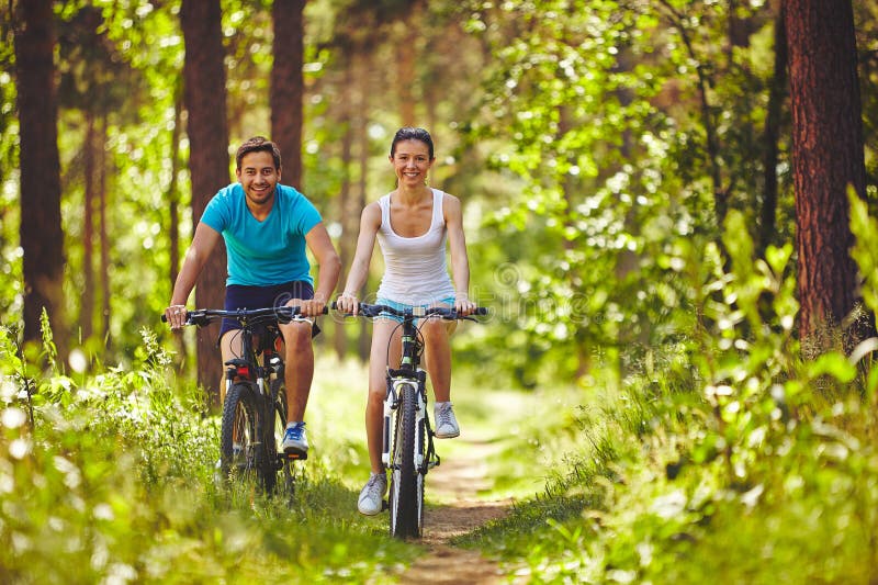 Couple on bicycles stock photo. Image of young, portrait - 55758572