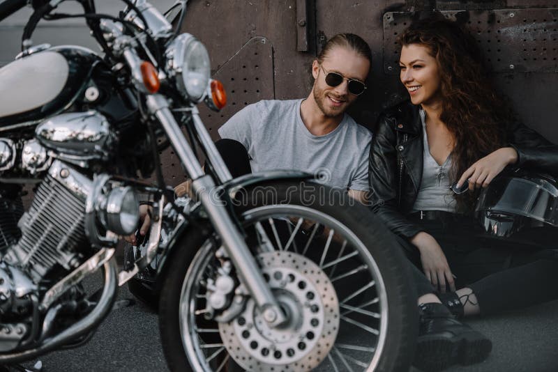 Couple of Bikers Sitting on Asphalt Stock Photo - Image of caucasian ...