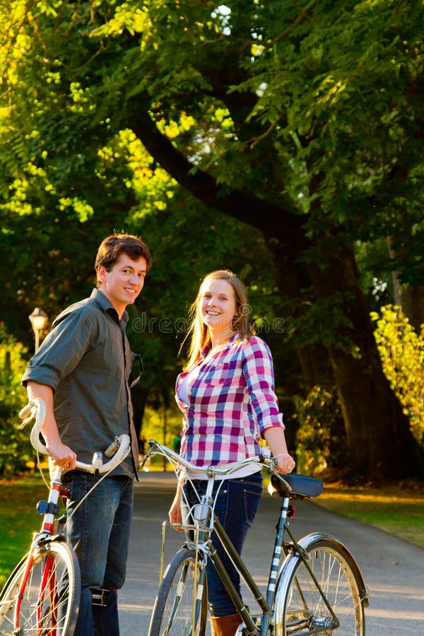 Couple with Bikes stock image. Image of bicycle, couple - 28757479