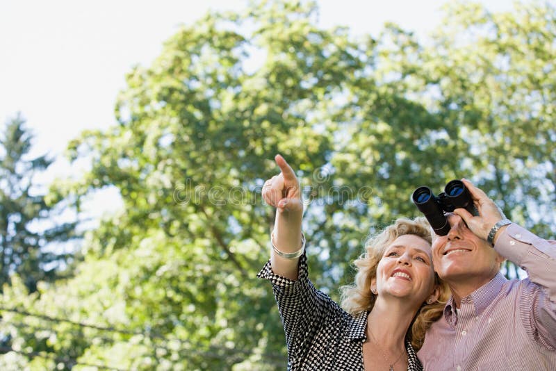 Couple with binoculars stock image. Image of husband - 62561545