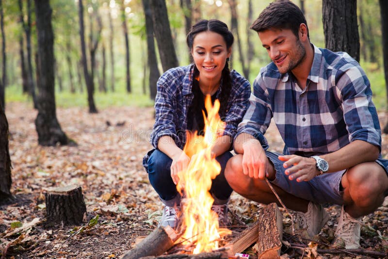 Couple and Bonfire in the Forest Stock Photo - Image of flame, barbecue ...