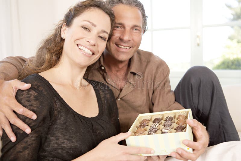 Couple with Box of Chocolates. Stock Image - Image of couple ...