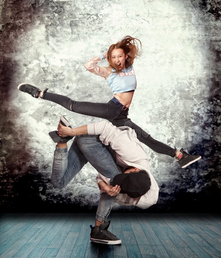 Couple Break Dancing on Wall Background Stock Photo - Image of lights ...