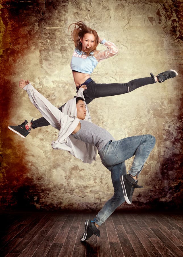 Couple Break Dancing on Wall Background Stock Photo - Image of lights ...