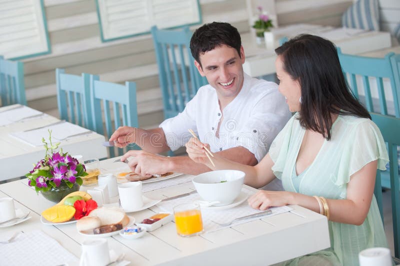 Young Couple Enjoying Hotel Breakfast Stock Photo - Image of thirties ...