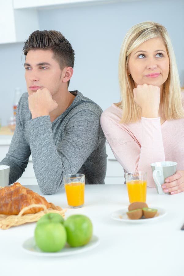 Couple at Breakfast Looking Fed Up Stock Image - Image of female ...