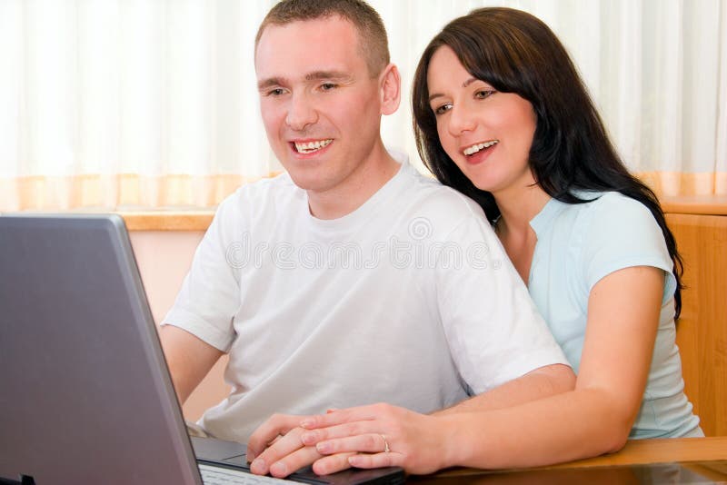 Couple Browsing Internet stock photo. Image of pretty - 2467084