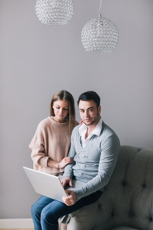 Couple Browsing Internet at Laptop. Stock Photo - Image of indoors ...