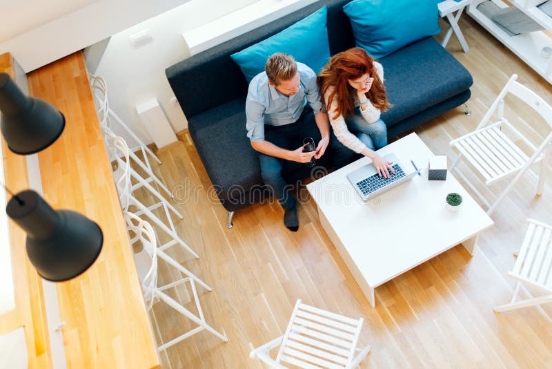 Couple Browsing Web Together in Living Room Stock Photo - Image of ...