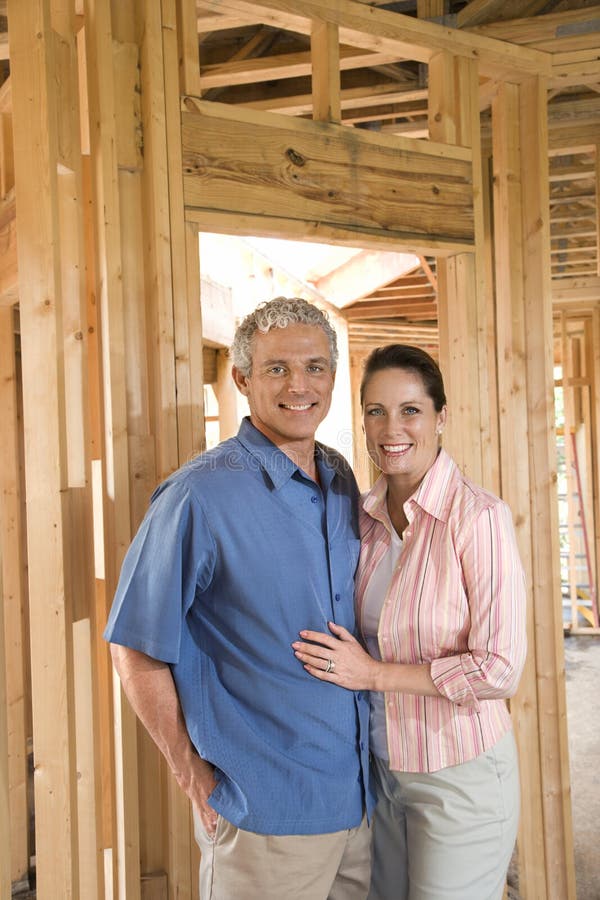 Couple at new home site. stock image. Image of coastal - 3470503