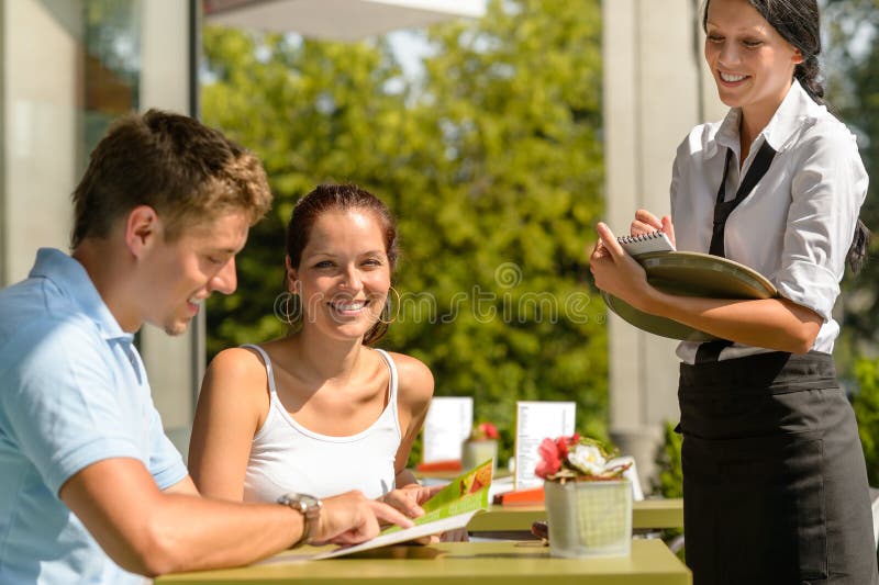 Couple at Cafe Ordering from Menu Waitress Stock Photo - Image of ...