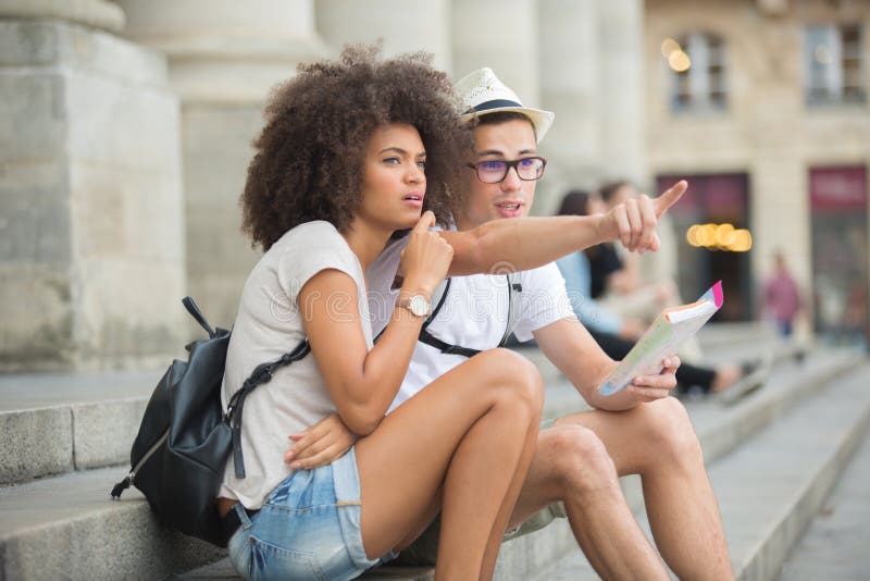 Couple with Camera and Travellers Guide Stock Photo - Image of route ...