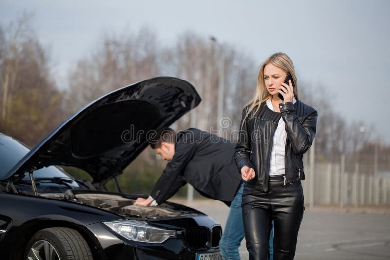 Couple after a Car Breakdown at the Side of the Road Stock Photo ...