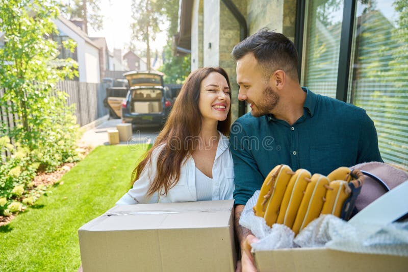 Couple Carries Boxes with Things from Open Trunk of Car Stock Image ...