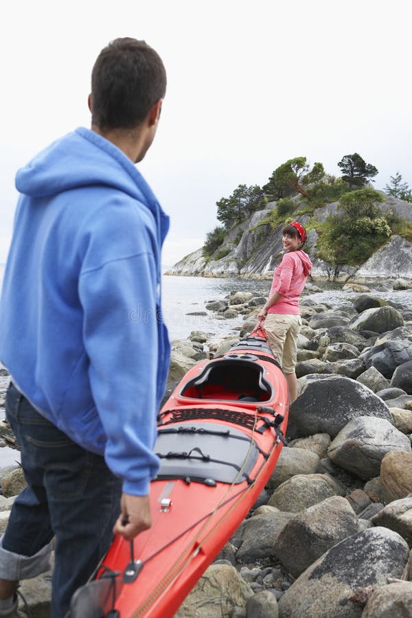 Men Carrying Kayak To River Stock Image - Image of boating, kayaking ...
