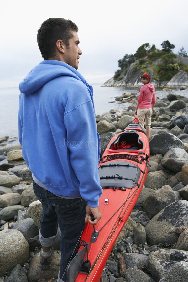 Men Carrying Kayak To River Stock Image - Image of boating, kayaking ...