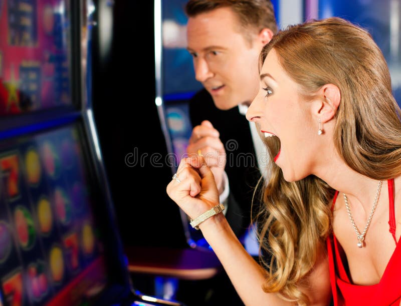 Couple in Casino stock photo. Image of slot, chips, woman - 19324400