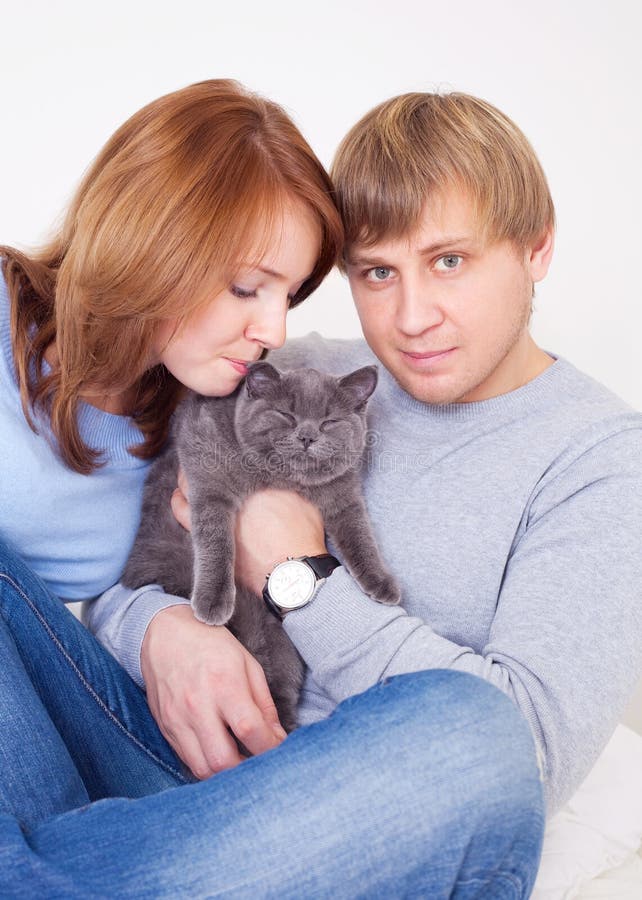 Couple with a cat stock photo. Image of cheerful, happiness - 17871598