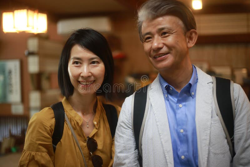 Couple checking in stock image. Image of bright, friend - 243965705