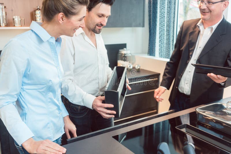 Couple Checking Out New Kitchen in the Store Stock Photo - Image of ...