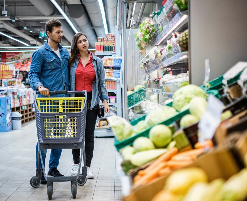 Couple Choosing Goods in a Grocery Store Stock Image - Image of payment ...
