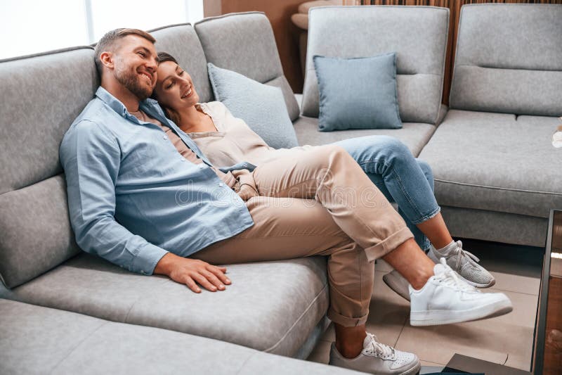 Couple Choosing the Sofa and Bed in the Store Stock Image - Image of ...