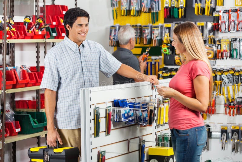 Couple Choosing Tools in Hardware Store Stock Image - Image of ...