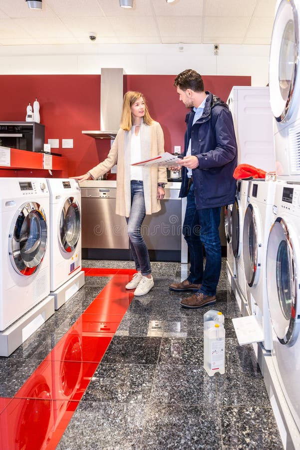 Couple Choosing Washing Machine in Hypermarket Stock Photo - Image of ...