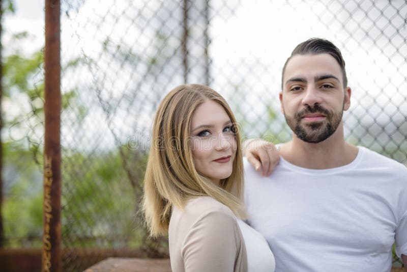 Couple Close To a Fence in a Day Stock Photo - Image of conversation ...