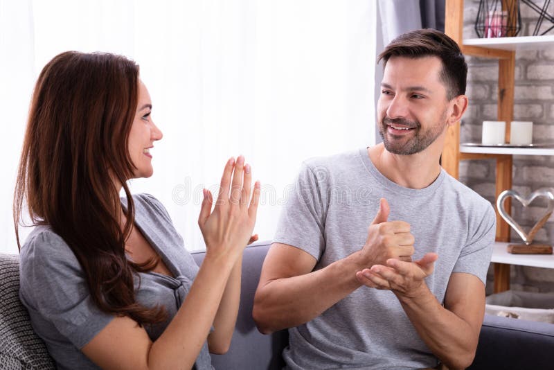 Couple Communicating with Sign Language Stock Image - Image of ...