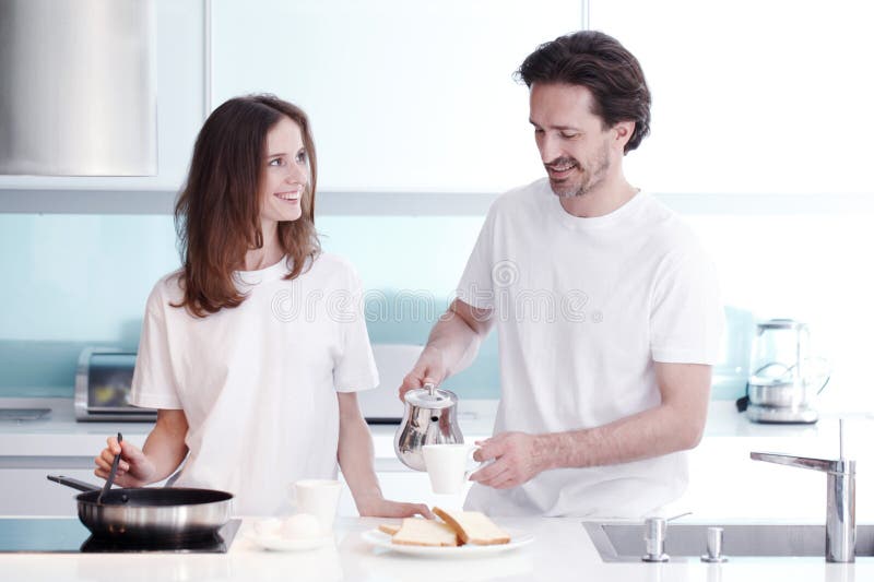 Couple cooking breakfast stock photo. Image of love, morning - 60976748