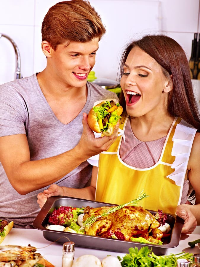 Couple Cooking Chicken at Kitchen. Stock Image - Image of family ...