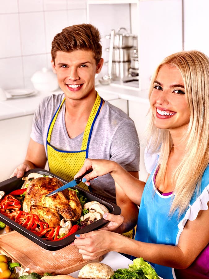 Couple Cooking Chicken at Kitchen Stock Photo - Image of couple ...