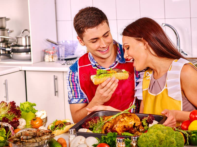 Couple Cooking Chicken at Kitchen Stock Photo - Image of housework ...