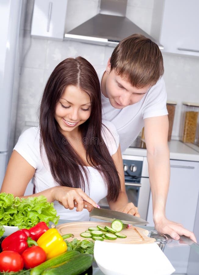 Couple cooking together stock photo. Image of beautiful - 17150242