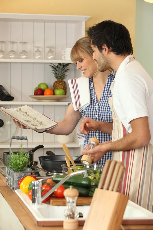 Couple in Love Cooking Together in the Kitchen and Have Fun Stock Photo ...