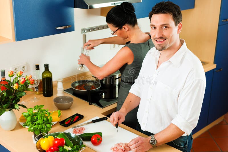 Couple Cooking Together in Kitchen Stock Image - Image of meat, herbs ...