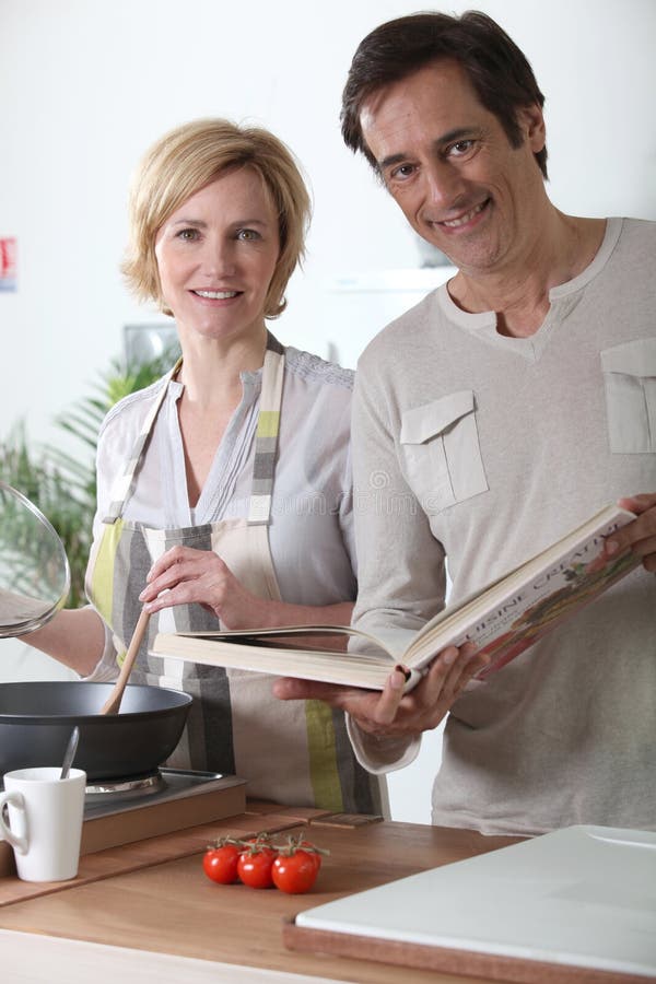 Couple cooking together stock photo. Image of adult, indoors - 35919024
