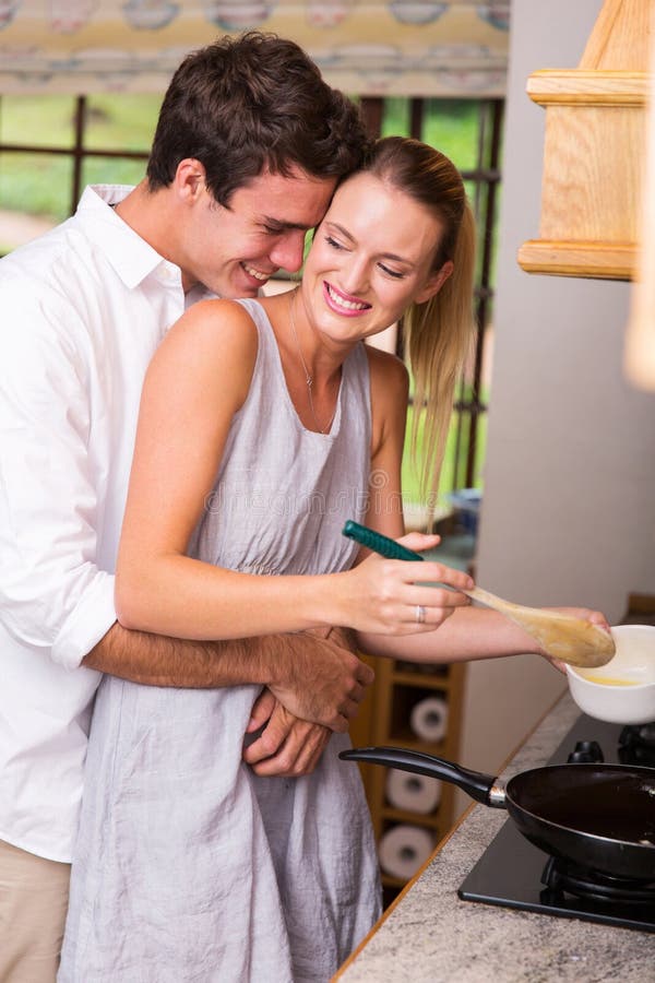 Couple cooking together stock image. Image of boyfriend - 50965133