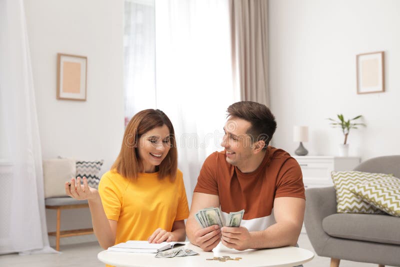 Couple Counting Money at Table Stock Image - Image of cash, living ...