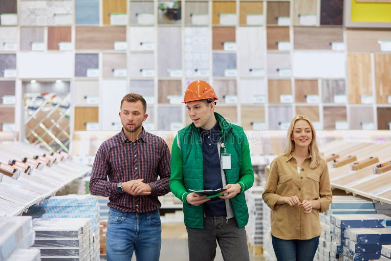 Couple Customers Asked for Help and Advice from Warehouse Worker Stock ...